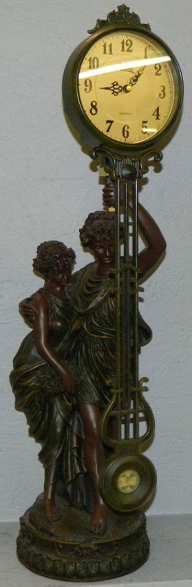 Free swinging repro clock, Crosa. : Lot 677