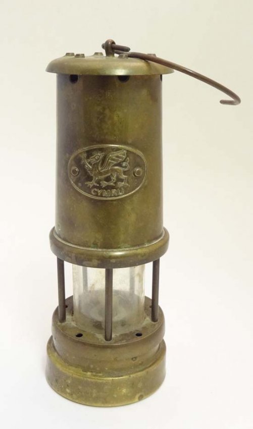 A Welsh miners lamp : A 'Cymru' brass Davy lamp