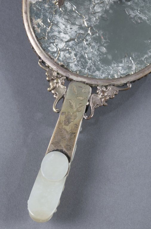 A Chinese jade medallion hand mirror. : Lot 380