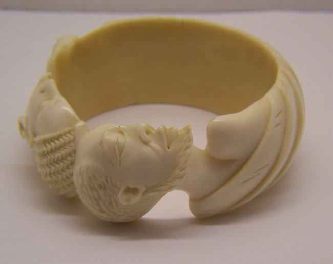 museum piece african couple carved ivory bracelet : Lot 493